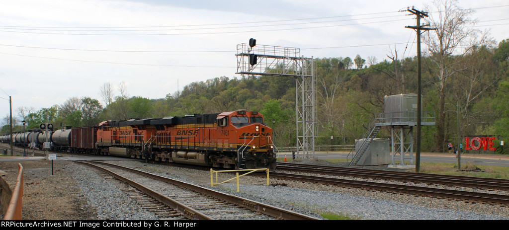 BNSF 7461 on oil train K08019 eastbound crossing Washington St. With the weird "LOVE" sign in view.